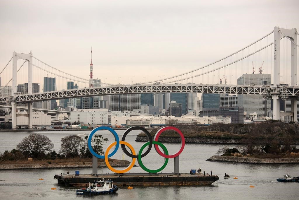 Olympic rings arrive in host city on barge into Tokyo Bay