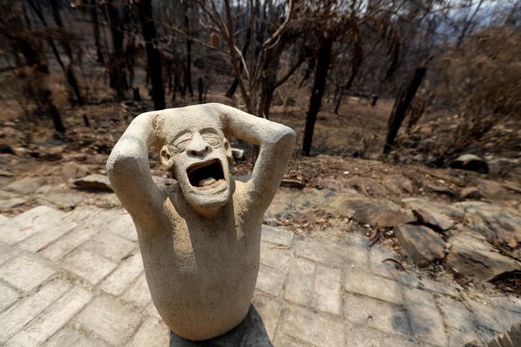 Australian village scorched by wildfires struggles with loss