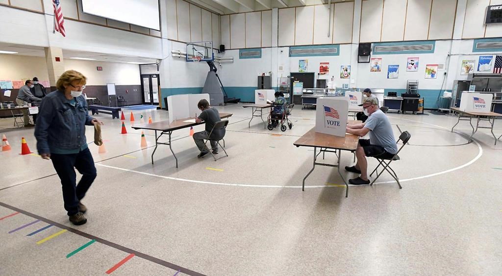 The Latest: Primary voting underway in 9 states and DC