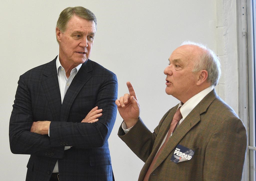 Perdue hugs Trump as he runs to right in Georgia GOP primary