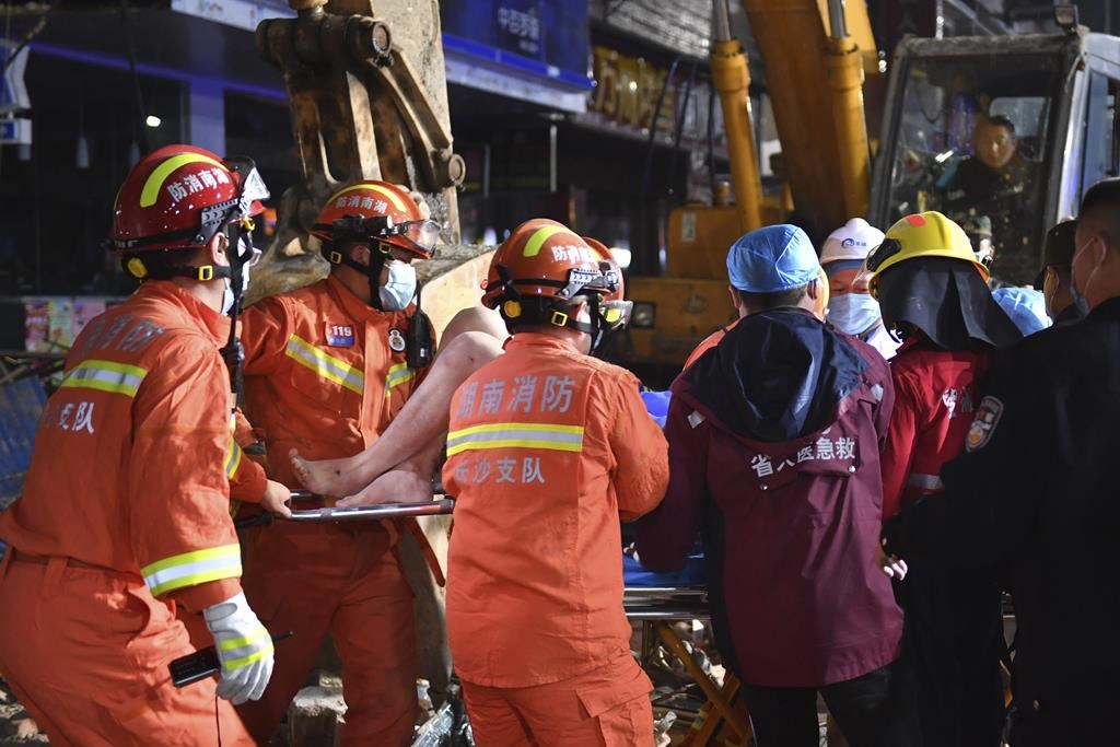 Police arrest 9 after building collapses in central China