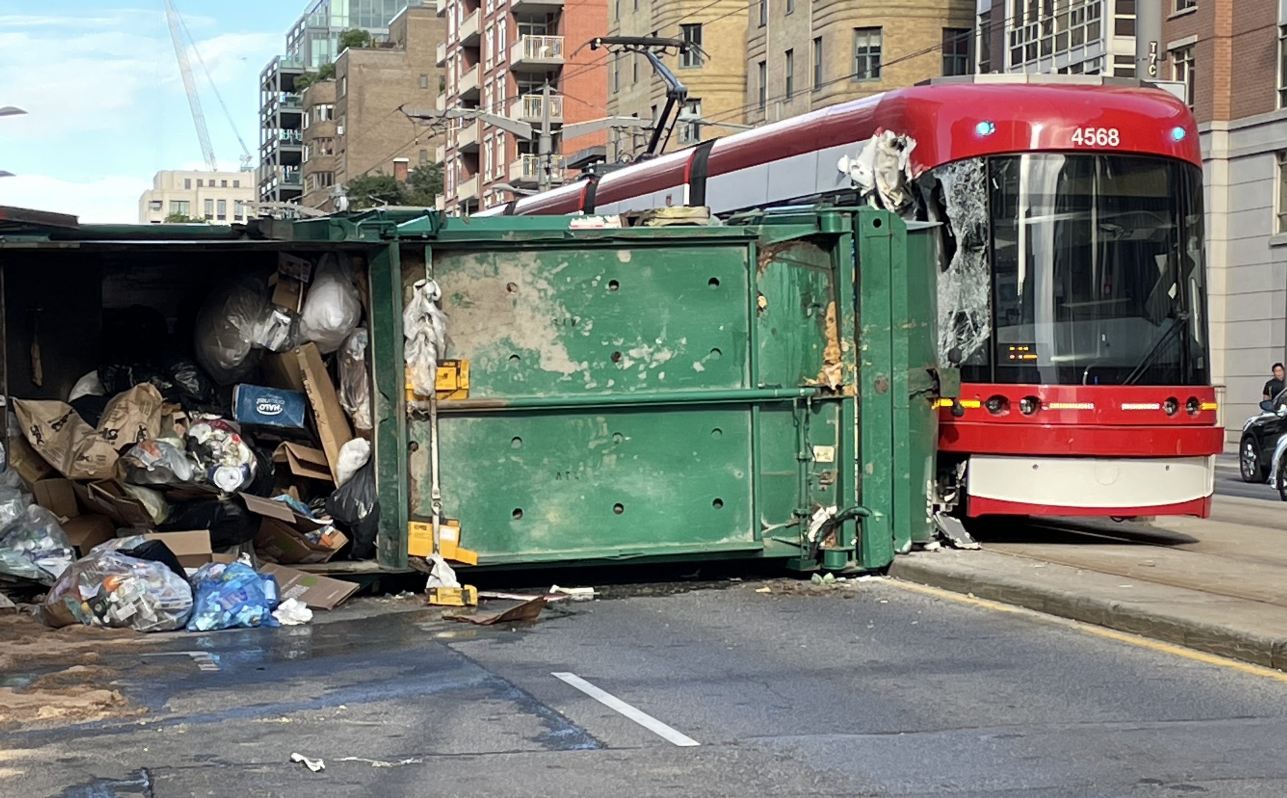 Dump truck knocked over in crash with TTC streetcar in Midtown Toronto