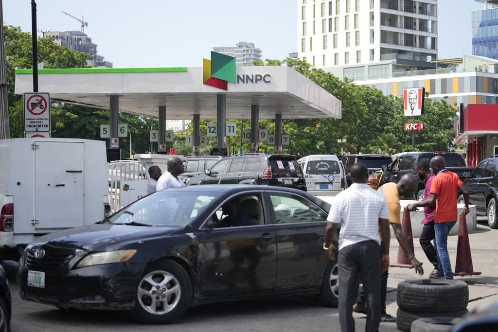 Drivers line up for gasoline across Nigeria after new president scraps fuel subsidy