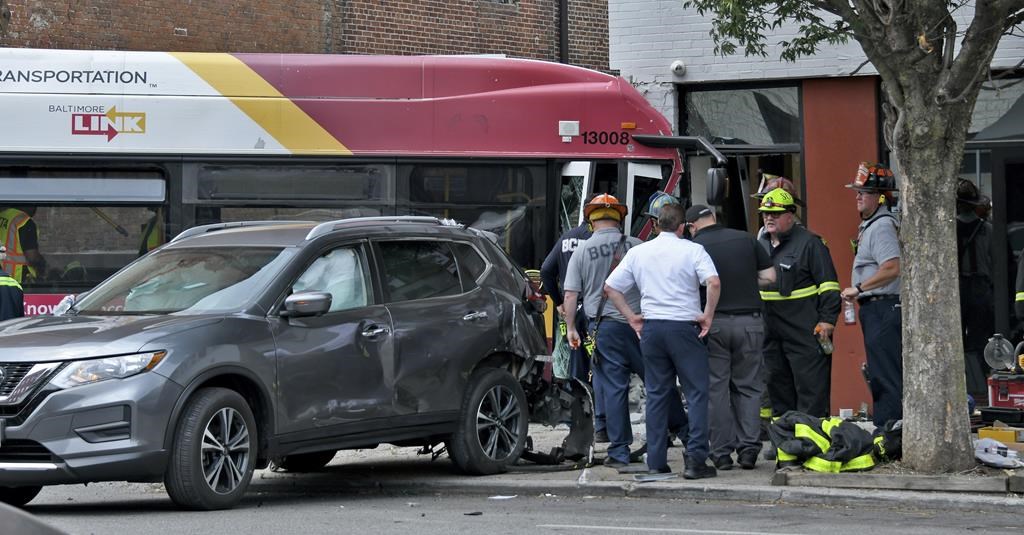 16 injured as Baltimore bus crashes into 2 cars, apartment building