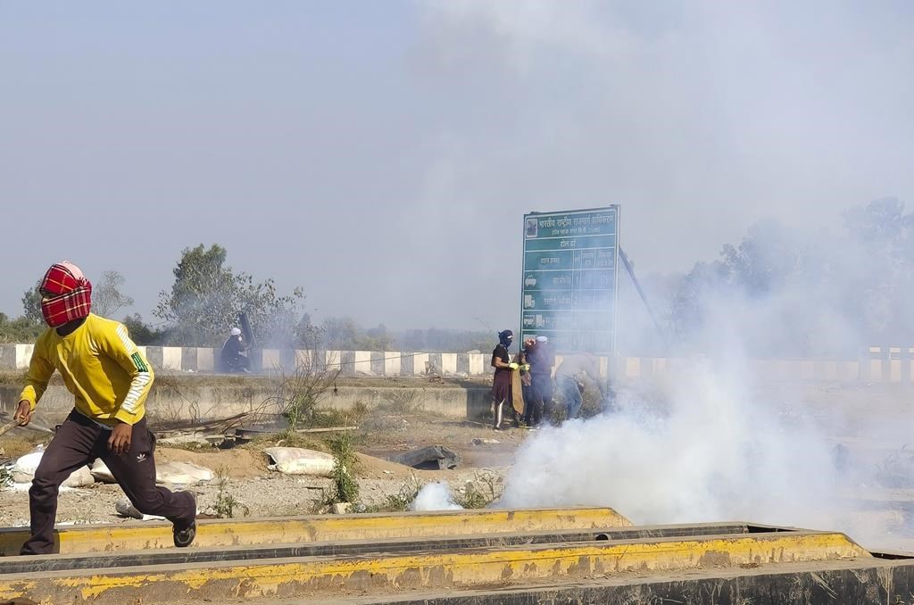 Protesting Indian farmers clash with police for a second day as they ...