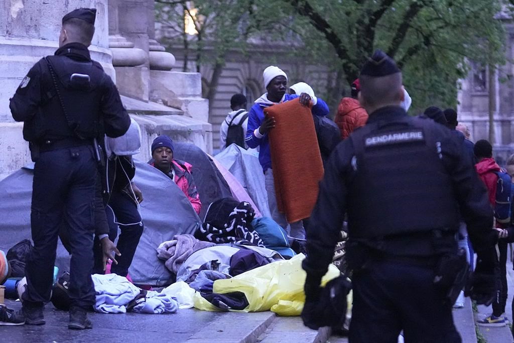 Ahead of the Paris Olympics, police clear a migrant camp near City Hall