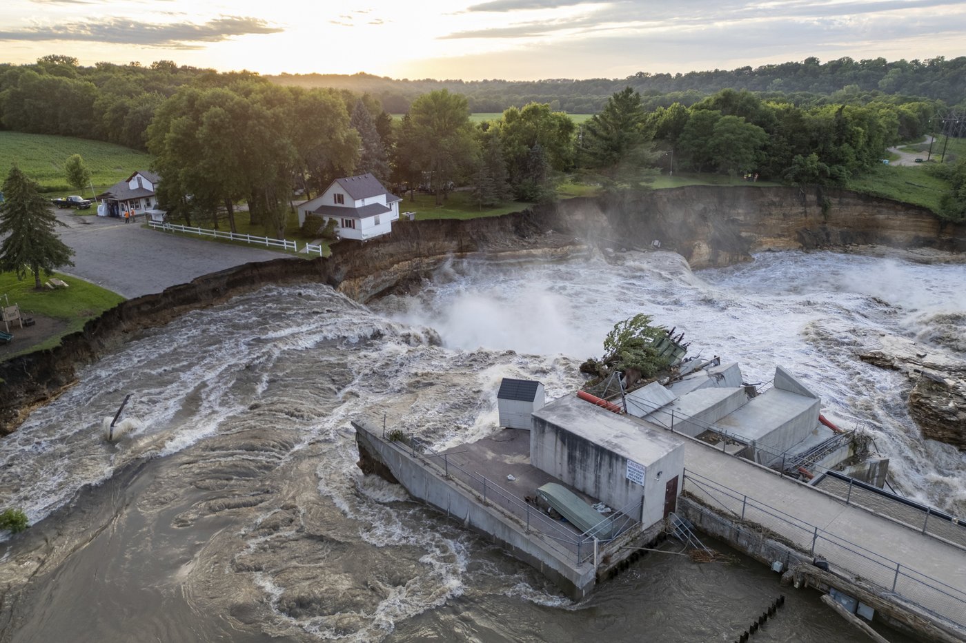 Swollen river claims house next to Minnesota dam as flooding and ...