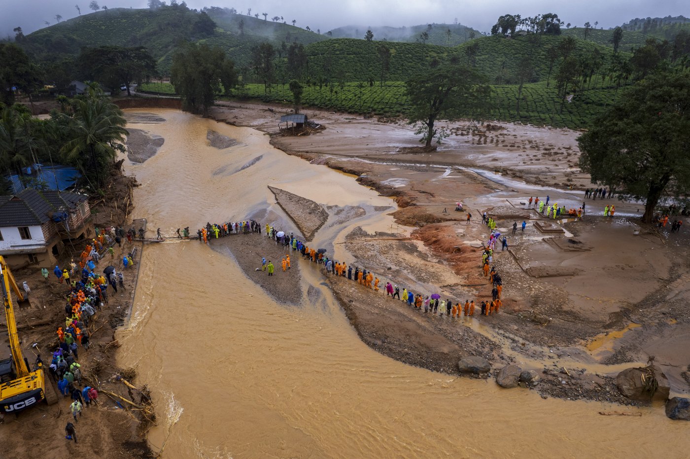 Rescuers search through mud and debris as deaths rise to 166 in ...
